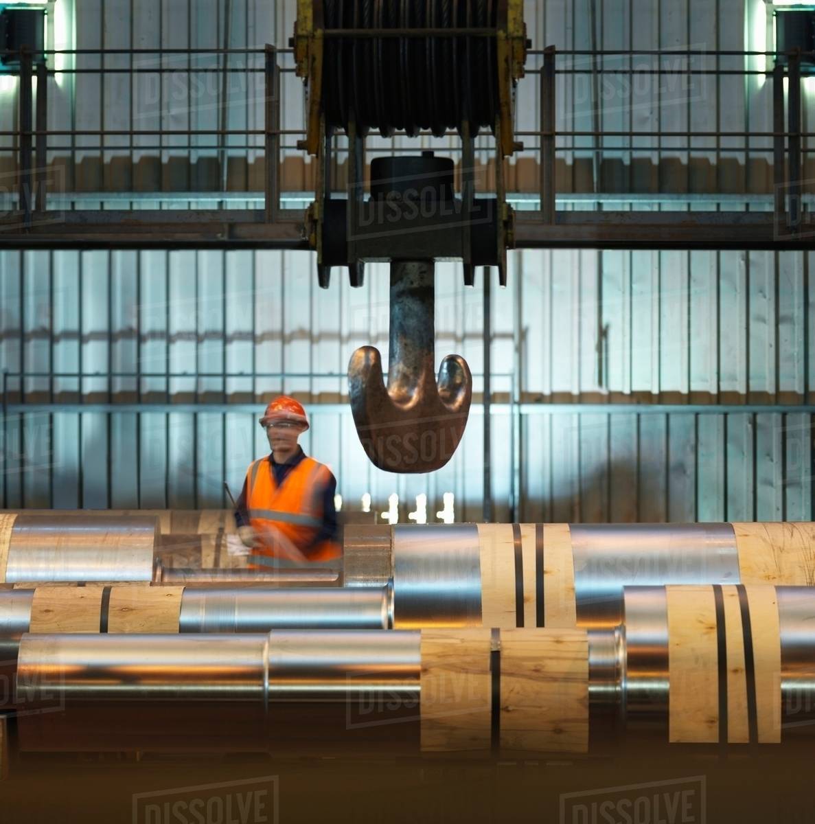 Engineer With Finished Steel Rollers - Stock Photo - Dissolve