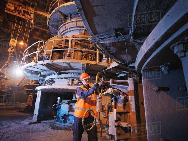 Worker Milling Coal In Power Station - Stock Photo - Dissolve