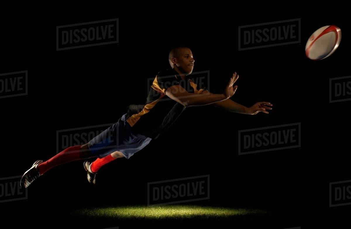 Rugby player diving whilst passing ball - Royalty-free Stock Photo ...