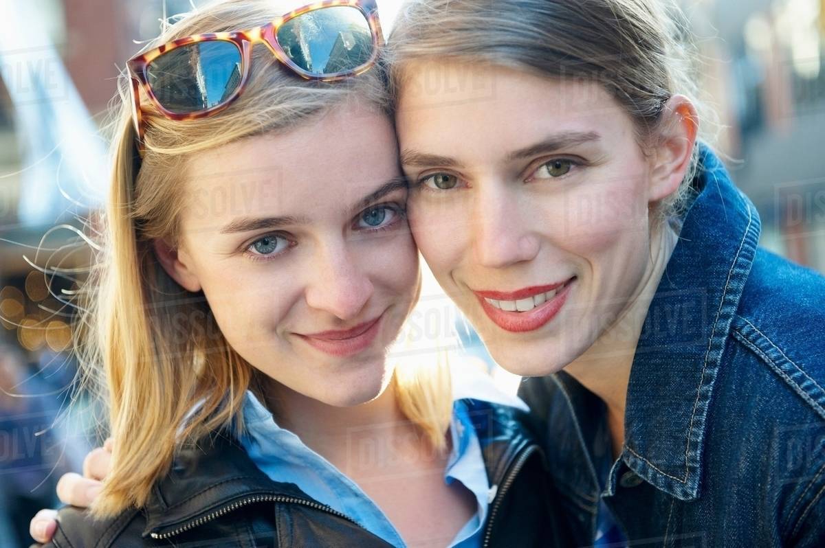 Portrait of two women, smiling - Stock Photo - Dissolve