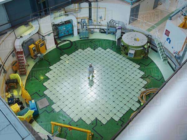 Engineer on Nuclear Reactor Pile cap - Stock Photo - Dissolve