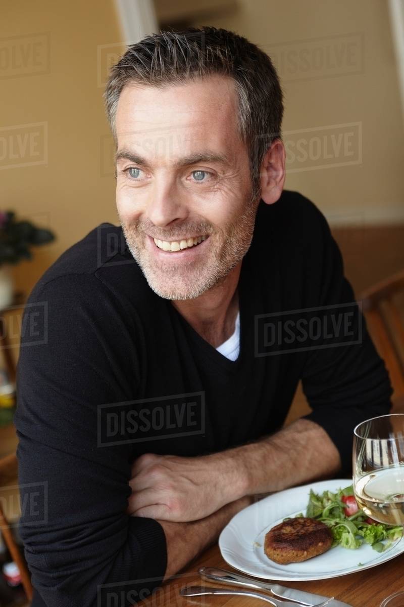 Man having dinner - Royalty-free Stock Photo | Dissolve