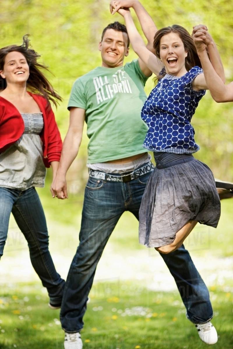 Energetic group of young people - Stock Photo - Dissolve