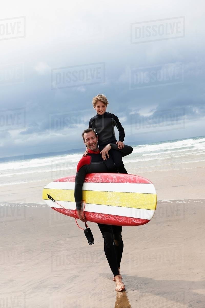 Father and son surfing - Royalty-free Stock Photo | Dissolve