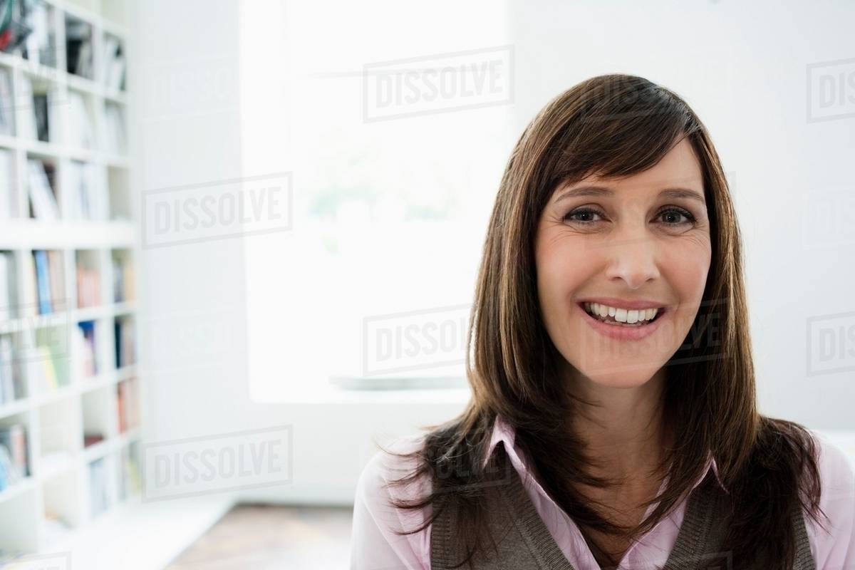 Woman smiling to camera - Stock Photo - Dissolve