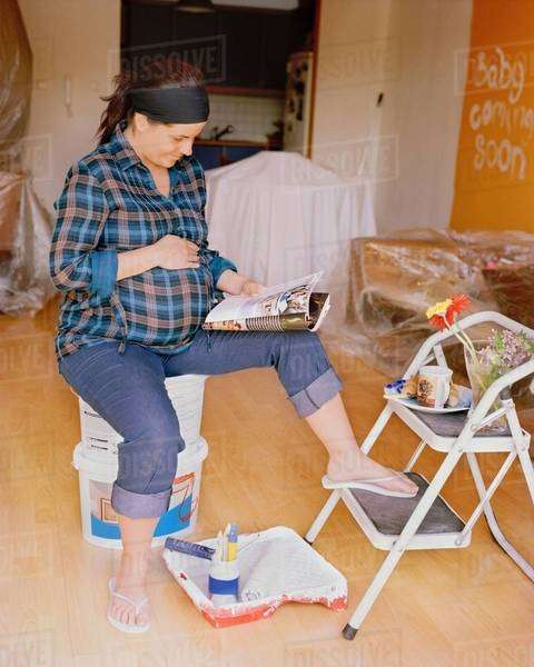 Pregnant woman nesting - Stock Photo - Dissolve