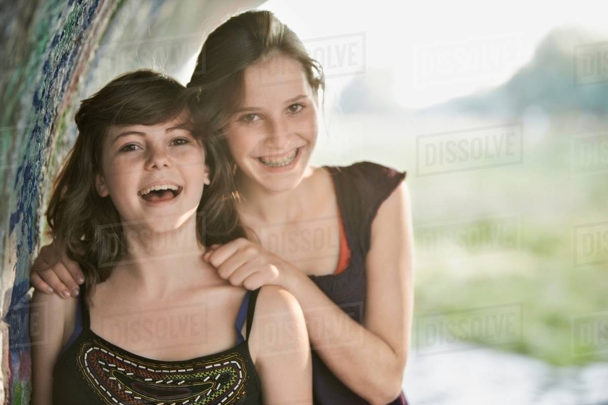 2 girls having fun together in a park - Stock Photo - Dissolve