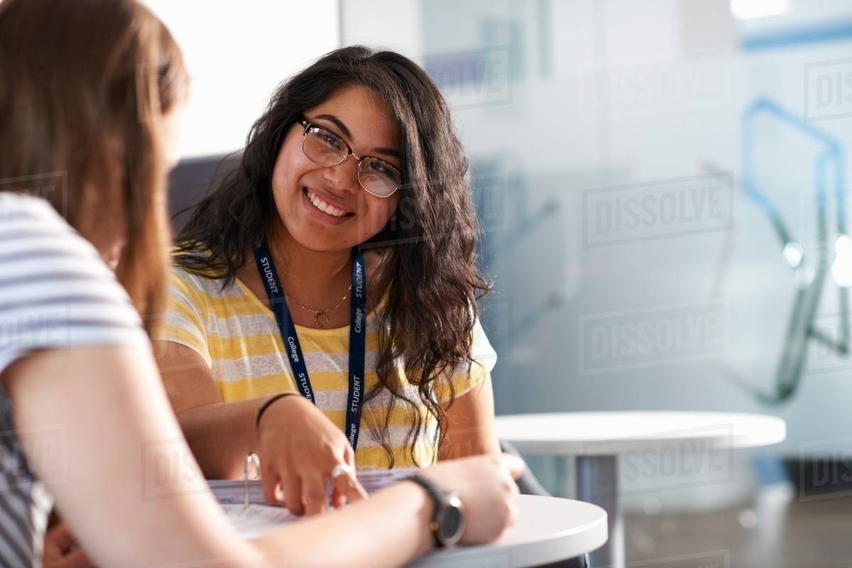 Two teenage girls working together in class - Royalty-free Stock Photo ...
