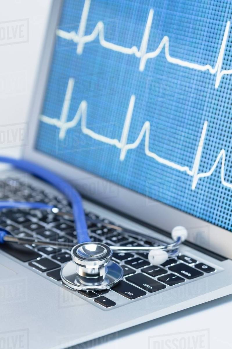 Modern cardiology. Acoustic stethoscope on a laptop computer that ...