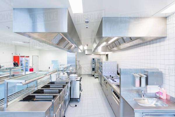 Empty factory canteen kitchen with serving hatch - Stock Photo - Dissolve