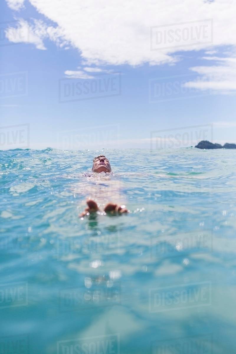 Swimmer floating the water - Royalty-free Stock Photo | Dissolve