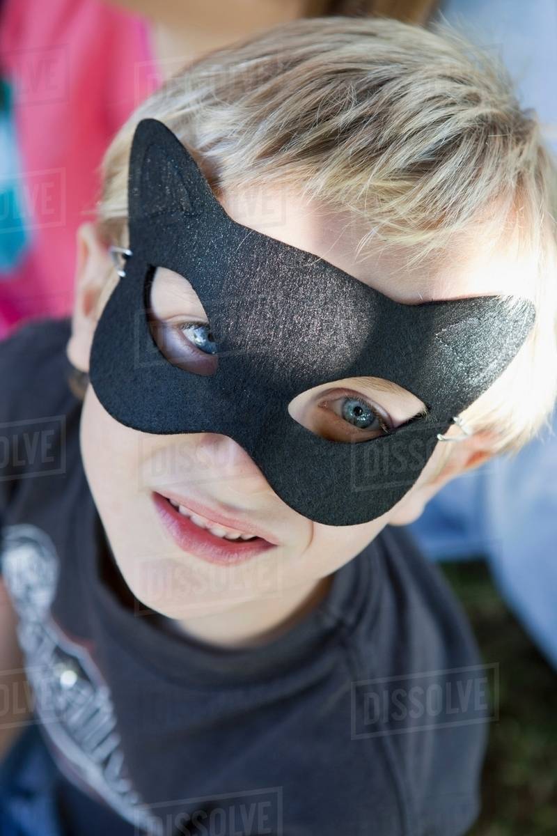 Close up of boy wearing cat mask - Stock Photo - Dissolve