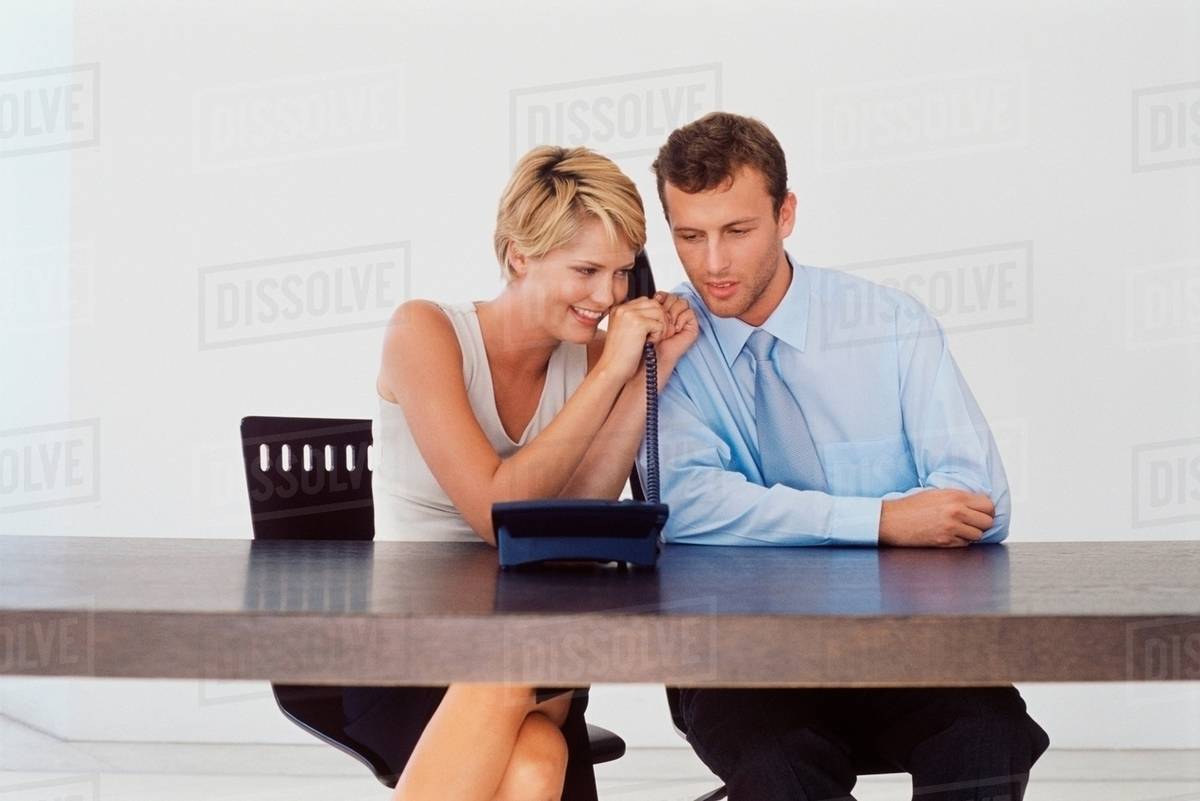 Business people talking on telephone - Royalty-free Stock Photo | Dissolve
