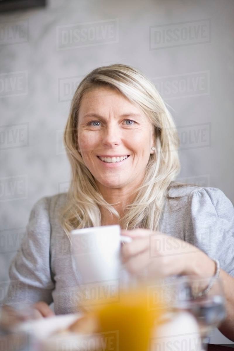 Older woman drinking coffee at breakfast - Royalty-free Stock Photo ...