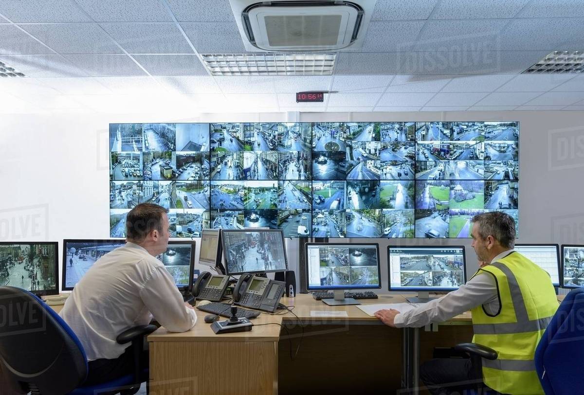 Security guards in security control room with video wall - Stock Photo ...