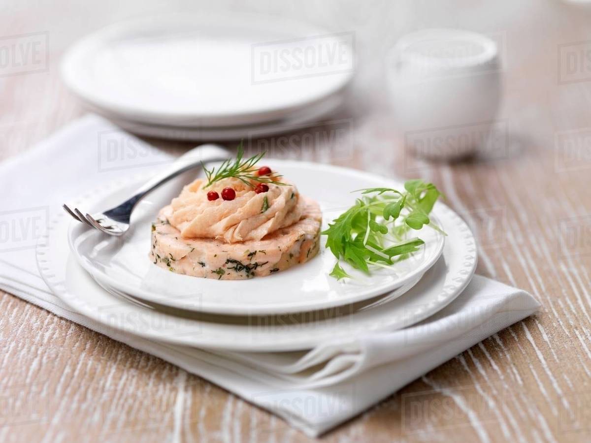 Garnished poached salmon starter - Royalty-free Stock Photo | Dissolve