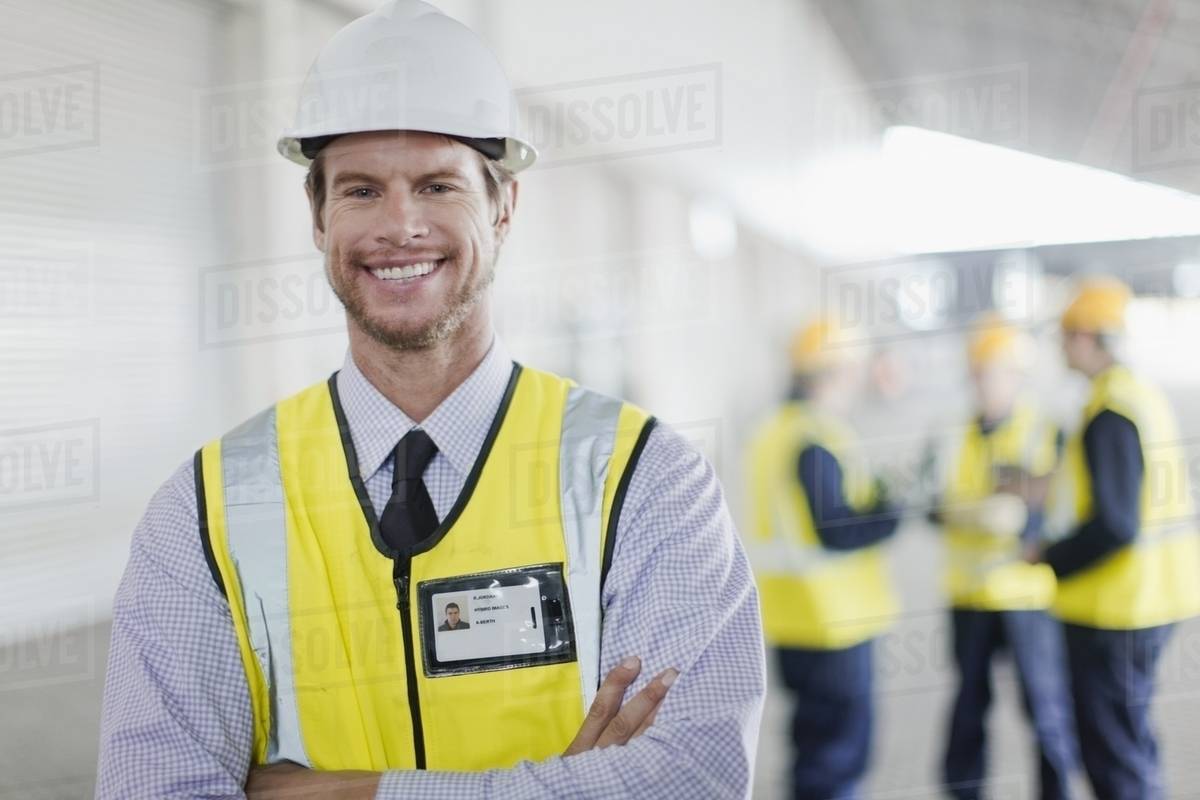 Worker standing in warehouse - Royalty-free Stock Photo | Dissolve