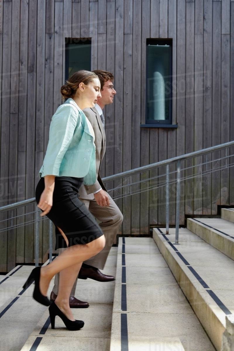 Business people walking up steps - Royalty-free Stock Photo | Dissolve