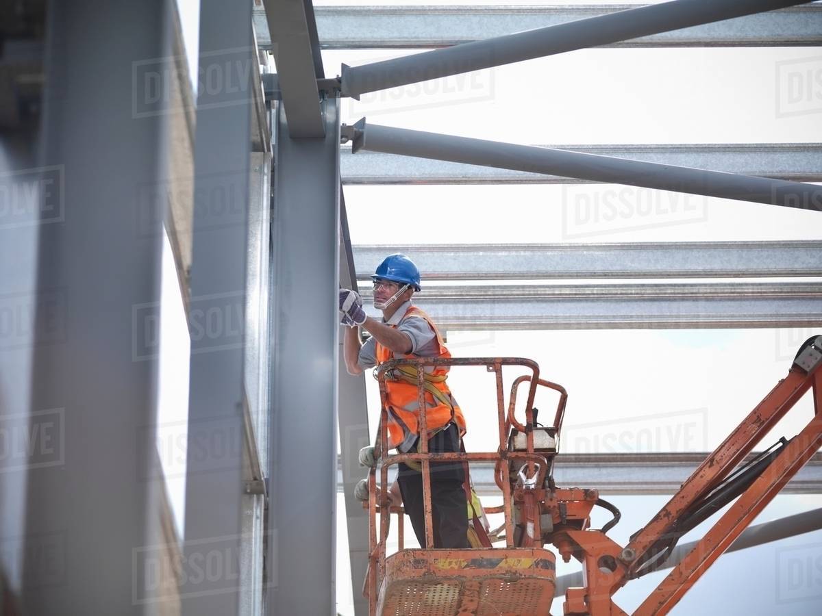 Construction workers in cherry picker - Stock Photo - Dissolve