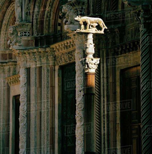 Statue of Lupa, the Roman she-wolf in front of Duomo Cathedral. Siena ...