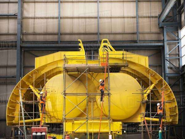 Engineers with mid water arch flotation device in shipping yard - Stock ...