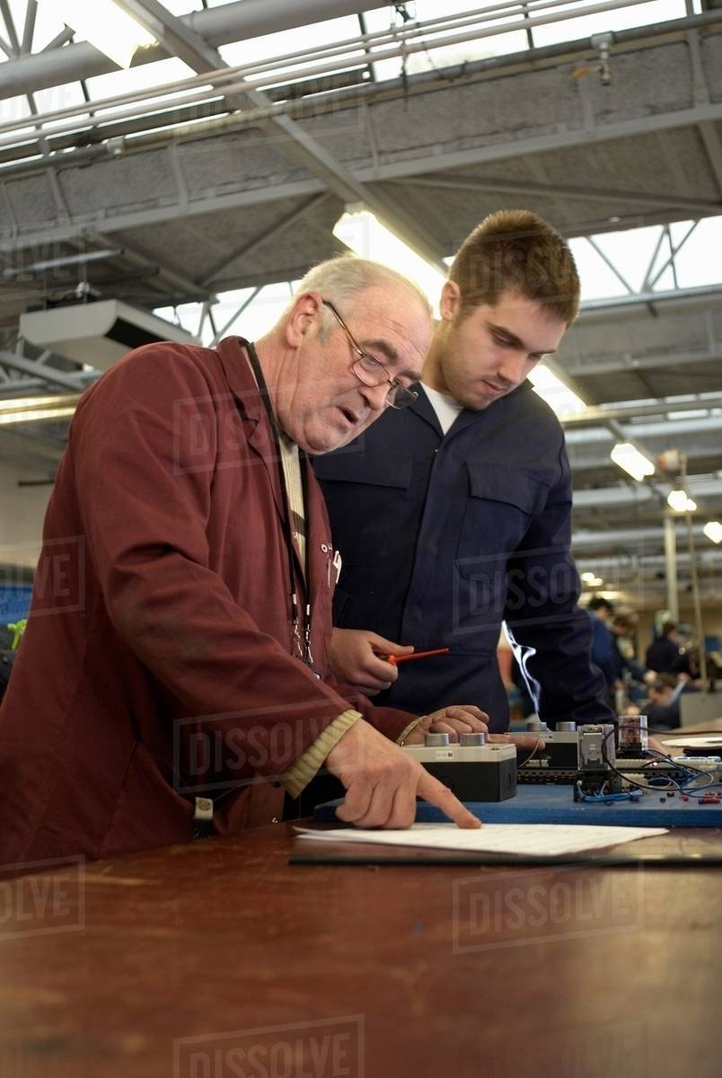 Electrical engineers working in shop - Royalty-free Stock Photo | Dissolve