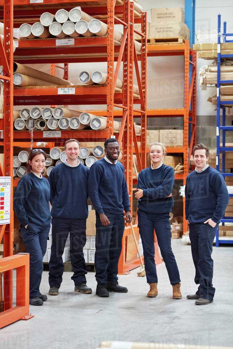 Portrait of factory work team in factory warehouse - Royalty-free Stock ...