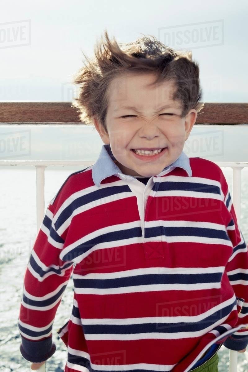 Close up of boy grimacing - Royalty-free Stock Photo | Dissolve