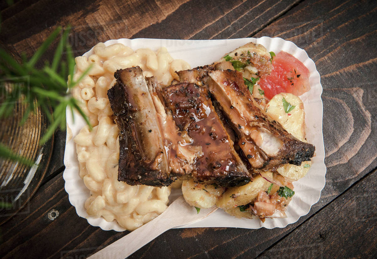 Ribs And Macaroni Cheese In Berlin Food Market Stock Photo Dissolve Ribs And Macaroni Cheese In Berlin Food Market Stock Photo Dissolve