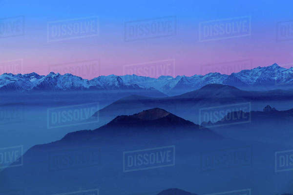 Elevated mountain landscape with valley mist at sunrise, Monte Generoso ...