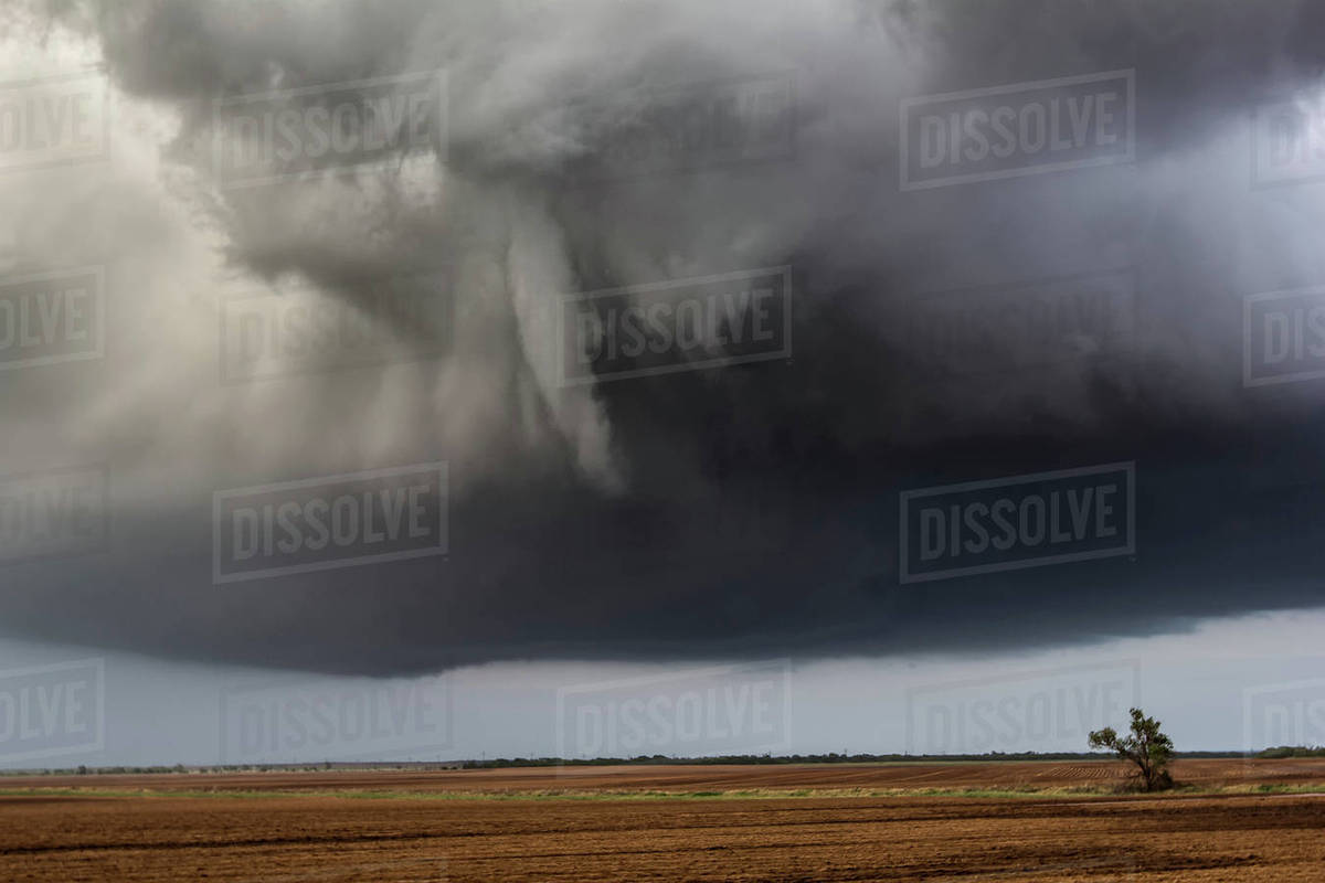 Funnel cloud over farmland - Royalty-free Stock Photo | Dissolve