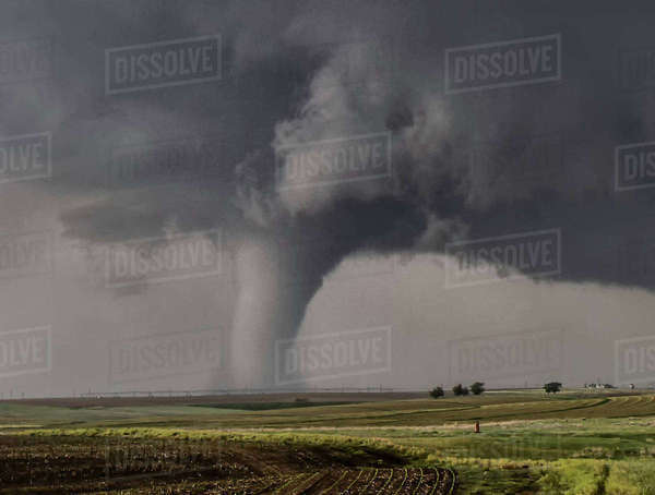 A large cone tornado touches down over the open prairie - Royalty-free ...