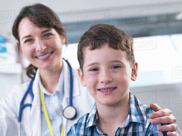 Doctor and boy in clinic - Royalty-free Stock Photo | Dissolve
