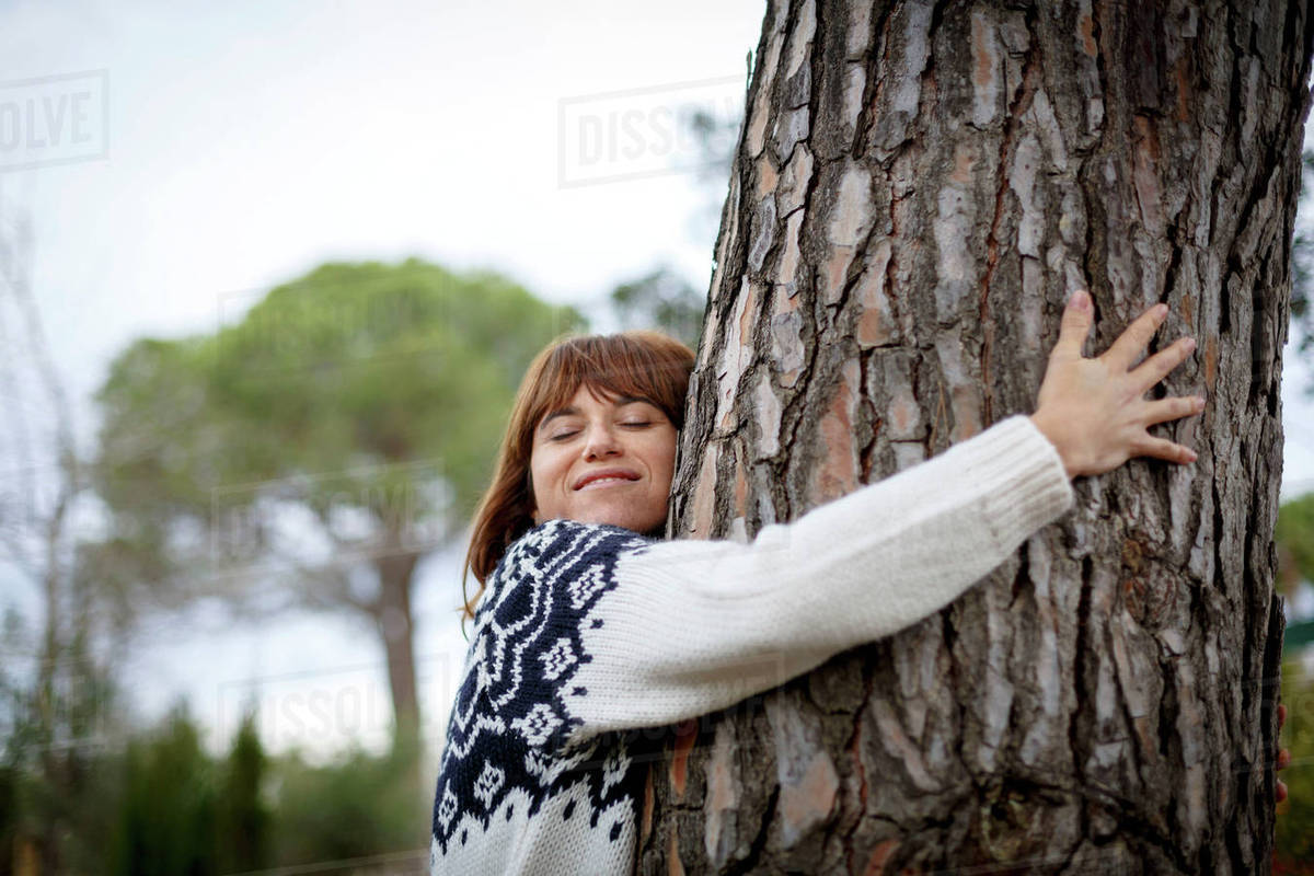 Woman hugging tree - Royalty-free Stock Photo | Dissolve