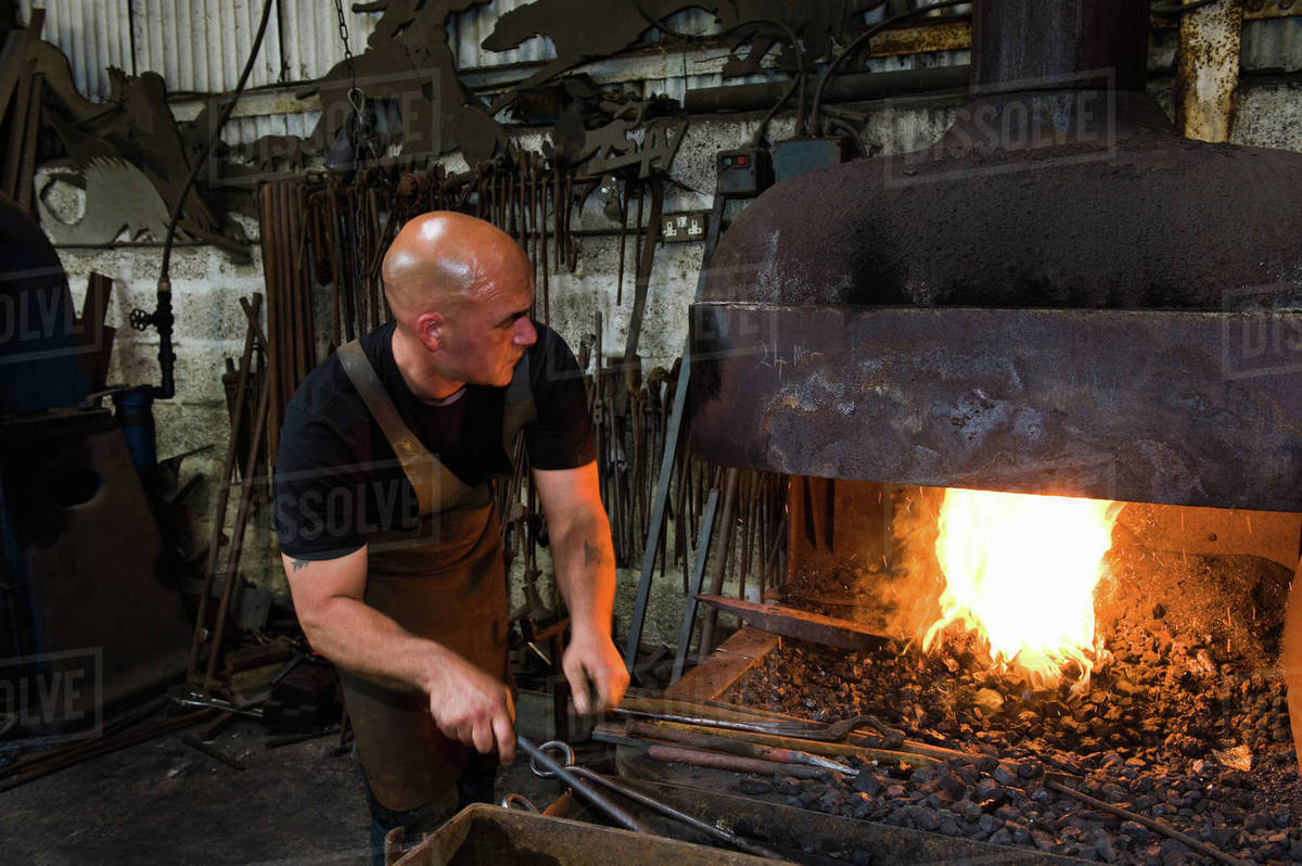 Blacksmith at work - Stock Photo - Dissolve