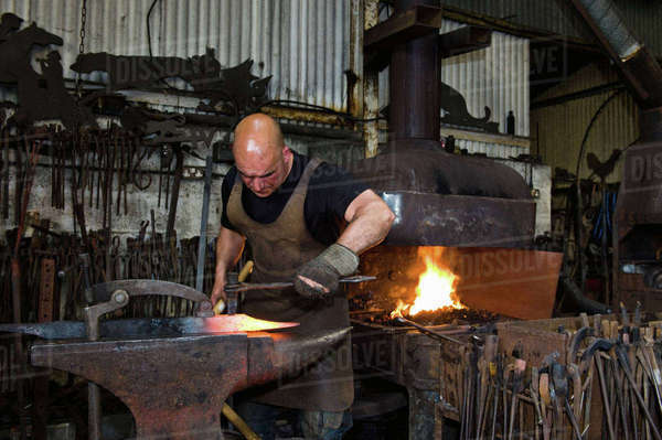 Blacksmith at work - Stock Photo - Dissolve
