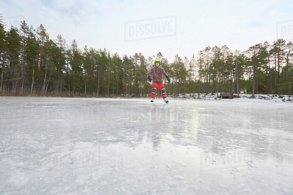 Boy ice skating on frozen lake, Gavle, Sweden - Royalty-free Stock ...