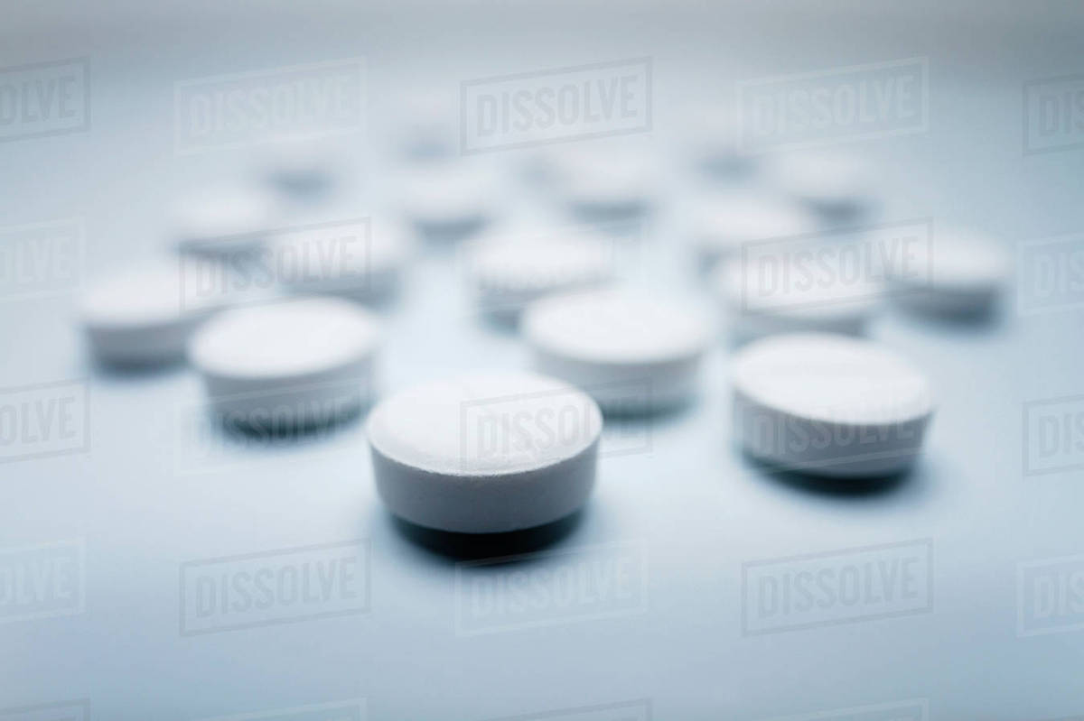 White circular pills - Royalty-free Stock Photo | Dissolve