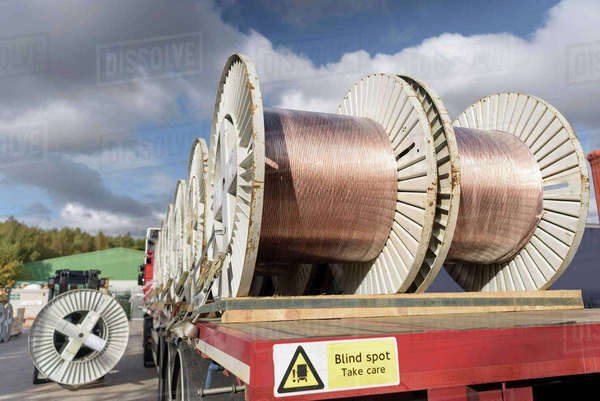 Cable reels on truck at cable storage facility - Stock Photo - Dissolve