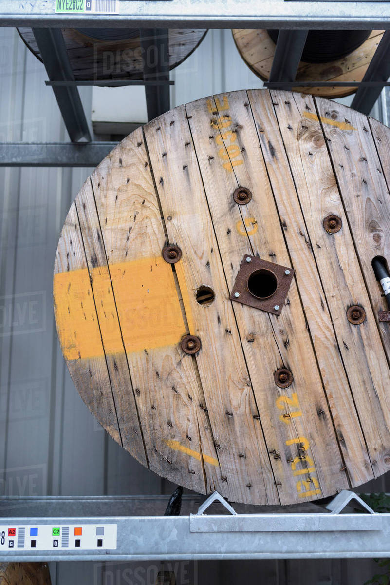 Electrical cable reel at cable storage facility - Stock Photo - Dissolve