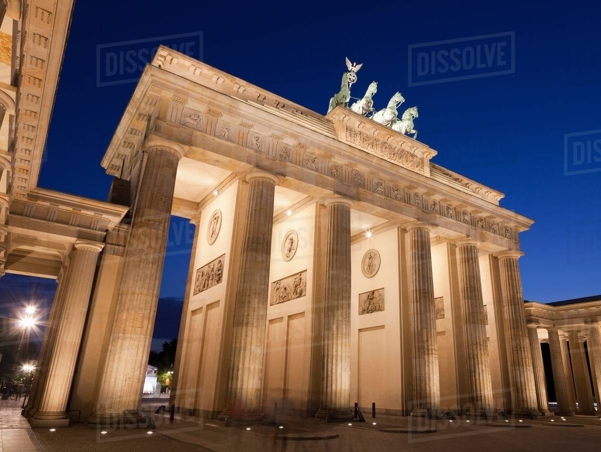 Ornate statues on columned building - Royalty-free Stock Photo | Dissolve