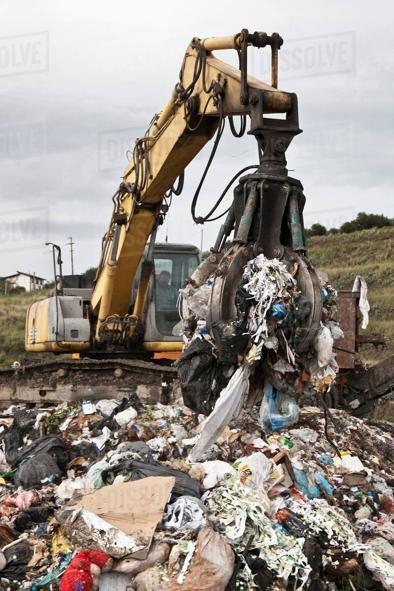 Crane at garbage collection center - Stock Photo - Dissolve