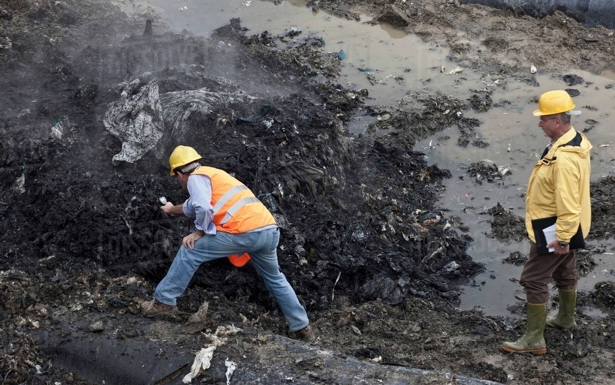 Workers at garbage collection center - Royalty-free Stock Photo | Dissolve