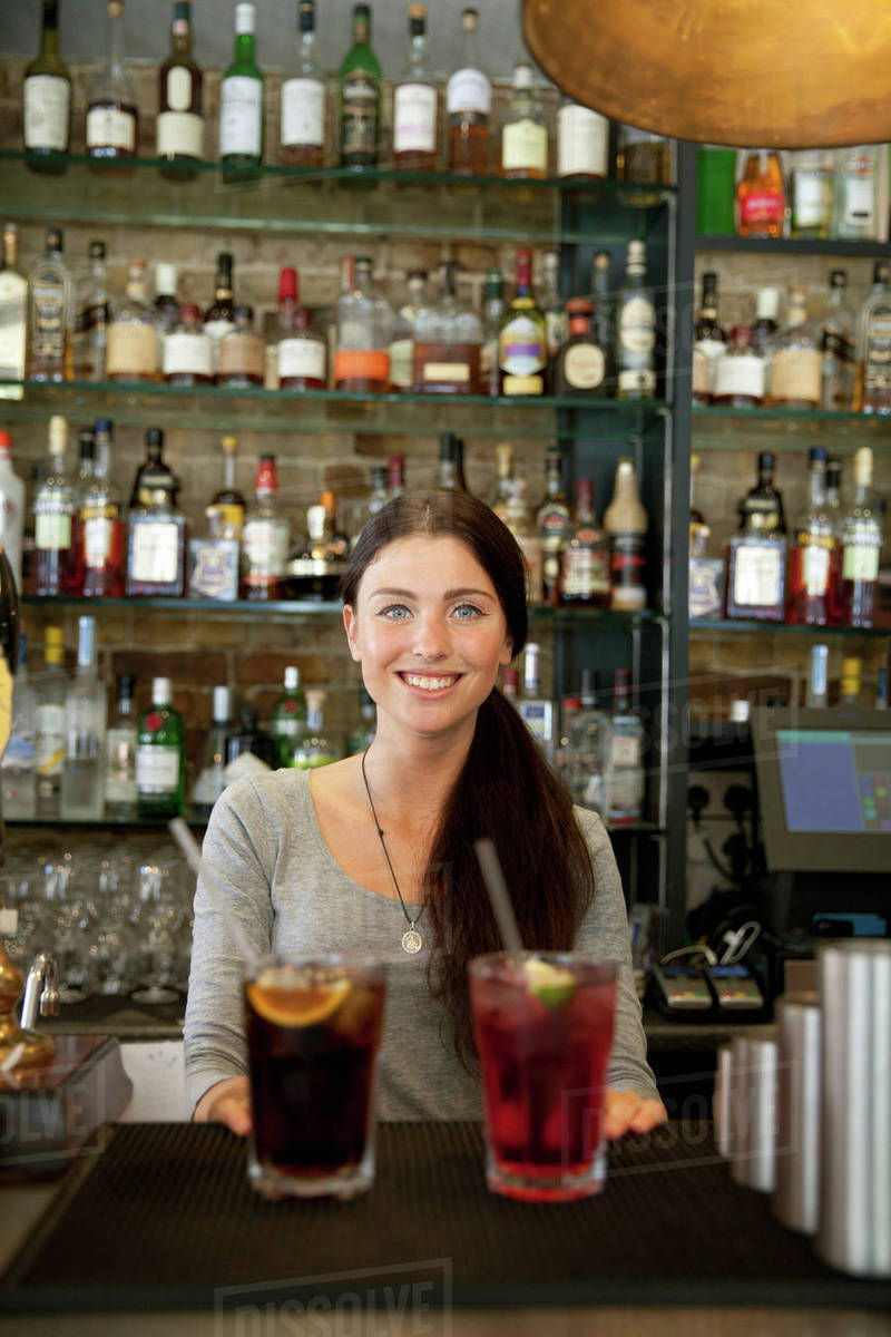 Bartender serving drinks in pub, London - Royalty-free Stock Photo ...