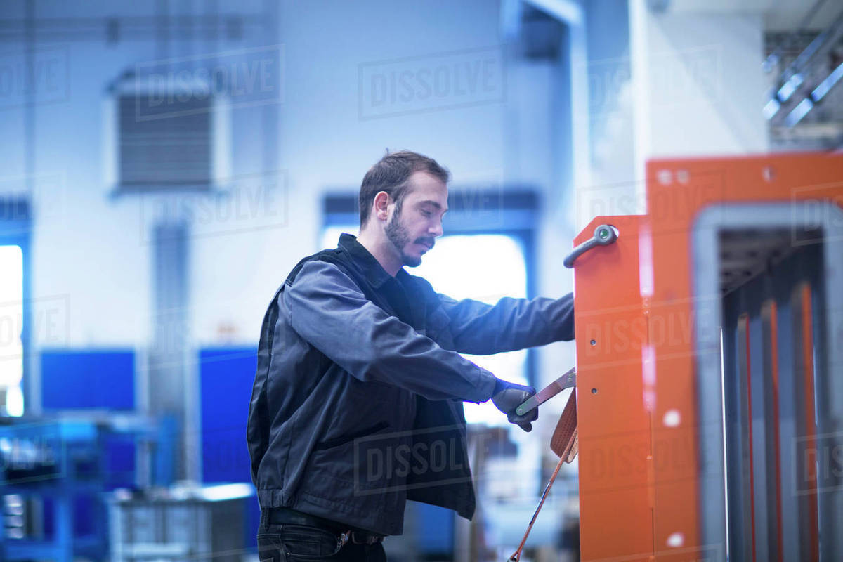 Engineer operating heavy machinery - Royalty-free Stock Photo | Dissolve