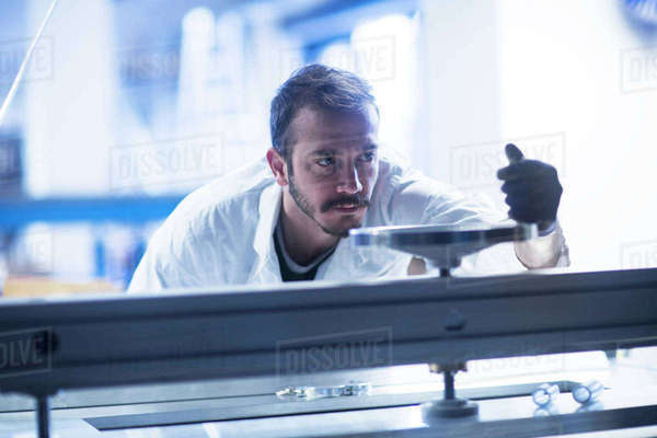 Scientist operating heavy machinery - Royalty-free Stock Photo | Dissolve