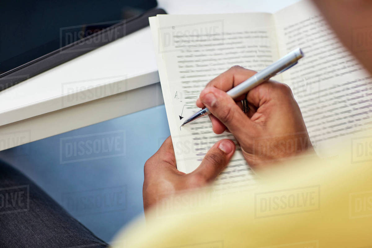 University student writing notes in book - Royalty-free Stock Photo ...