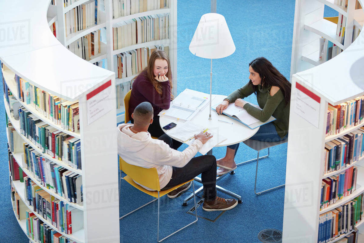 University students working in library - Royalty-free Stock Photo ...