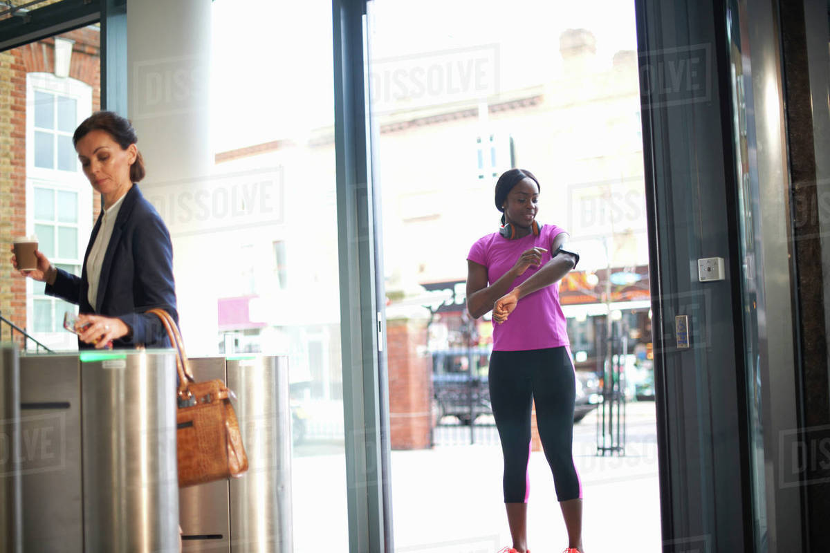 Women arriving at entrance to work - Royalty-free Stock Photo | Dissolve