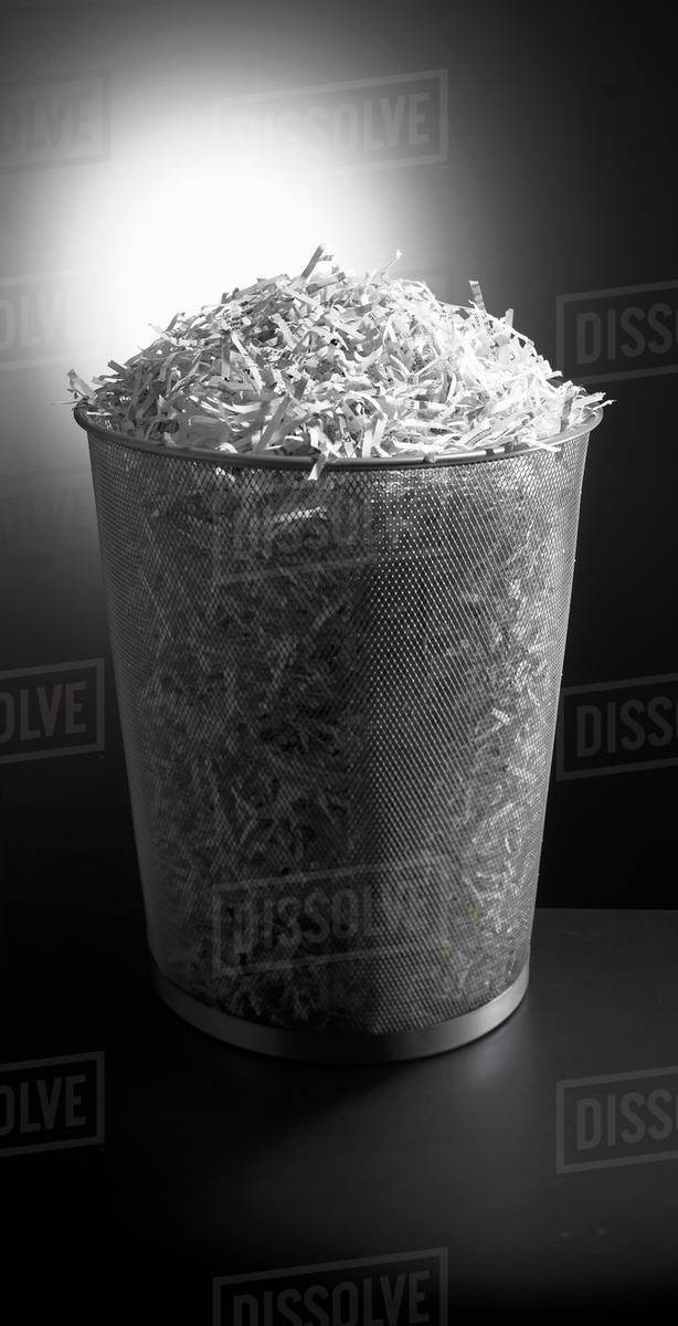 Trash can full of shredded paper - Royalty-free Stock Photo | Dissolve